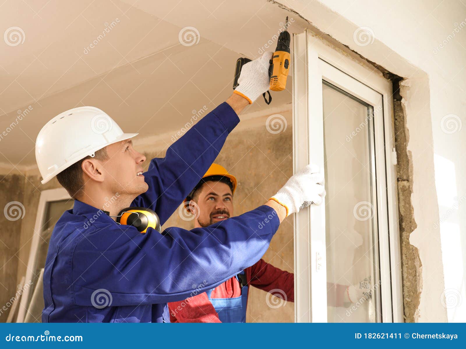 Workers Using Electric Screwdriver for Window Installation Stock Image ...