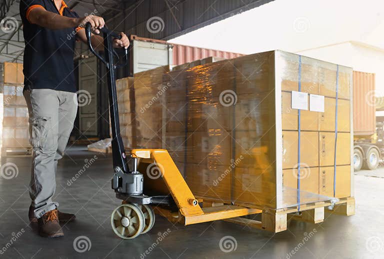 Workers Using Hand Pallet Jack Unloading Package Boxes into Cargo ...