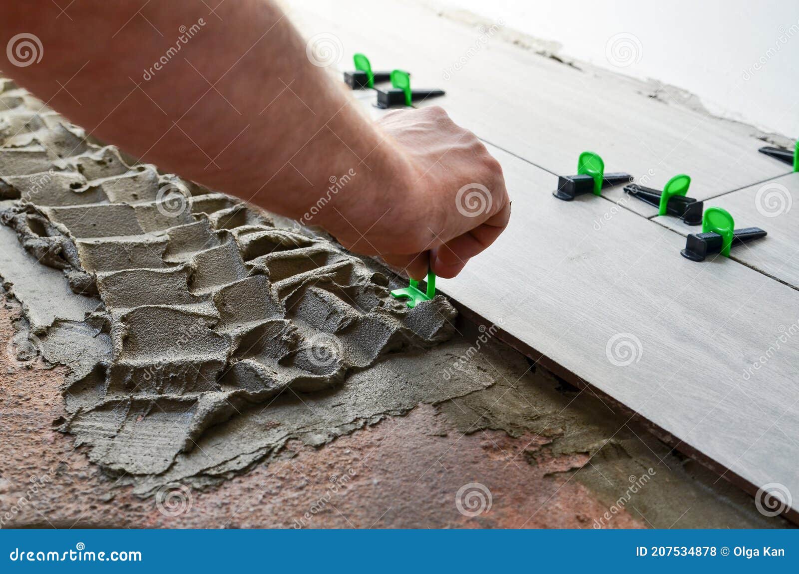 Workers are Using Plastic Clamps and Wedges To Leveling the Large ...