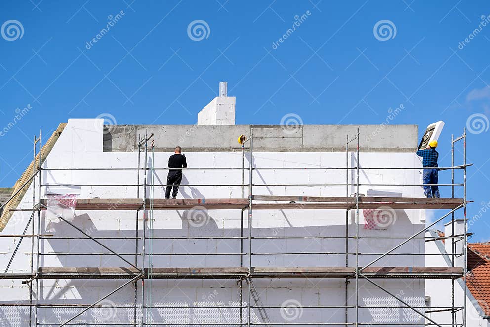 Workers Using Polystyrene and Install Styrofoam Material on Wall Stock ...