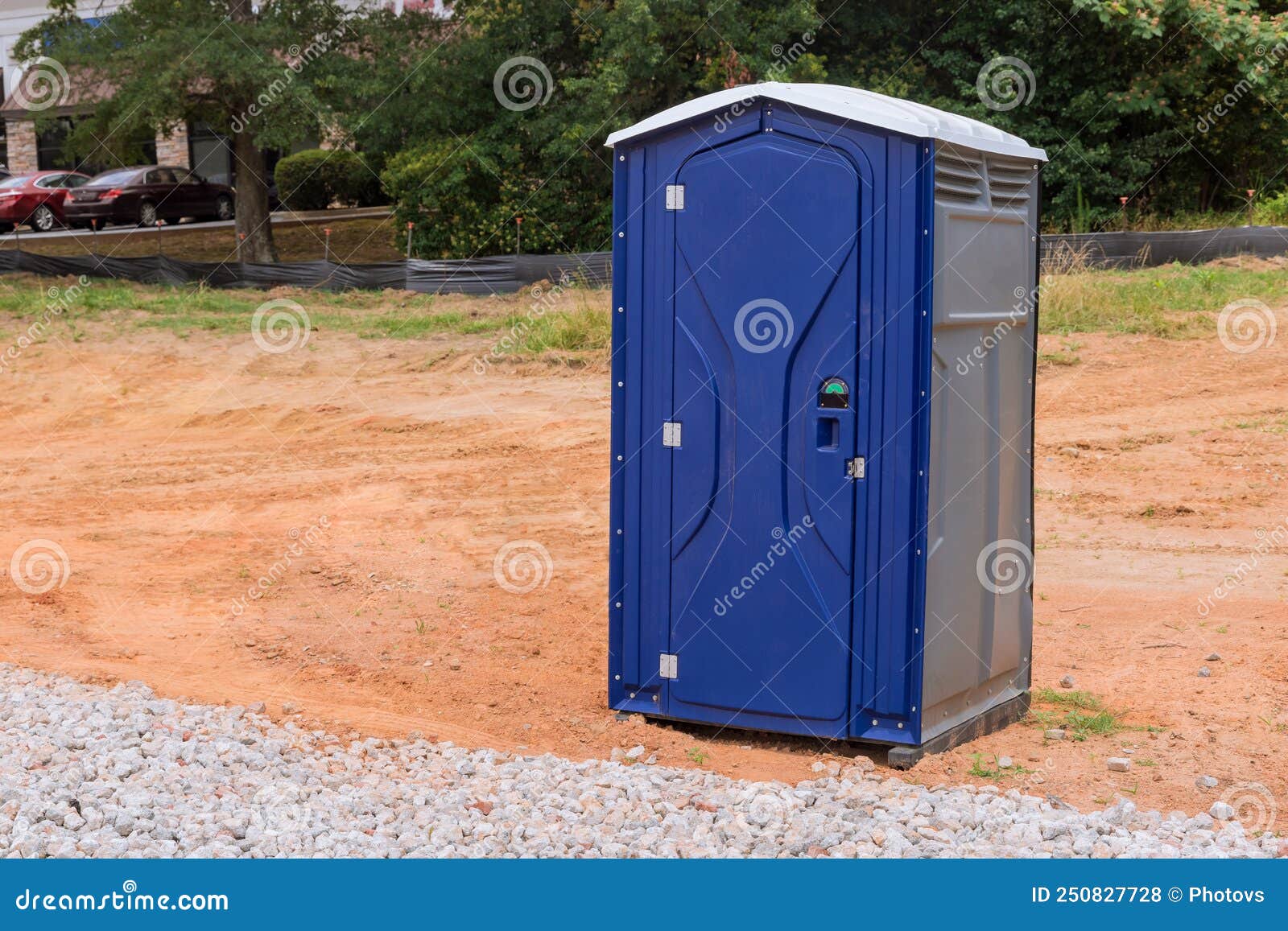 Workers Using a Portable Restroom Near on a Construction Site Stock ...