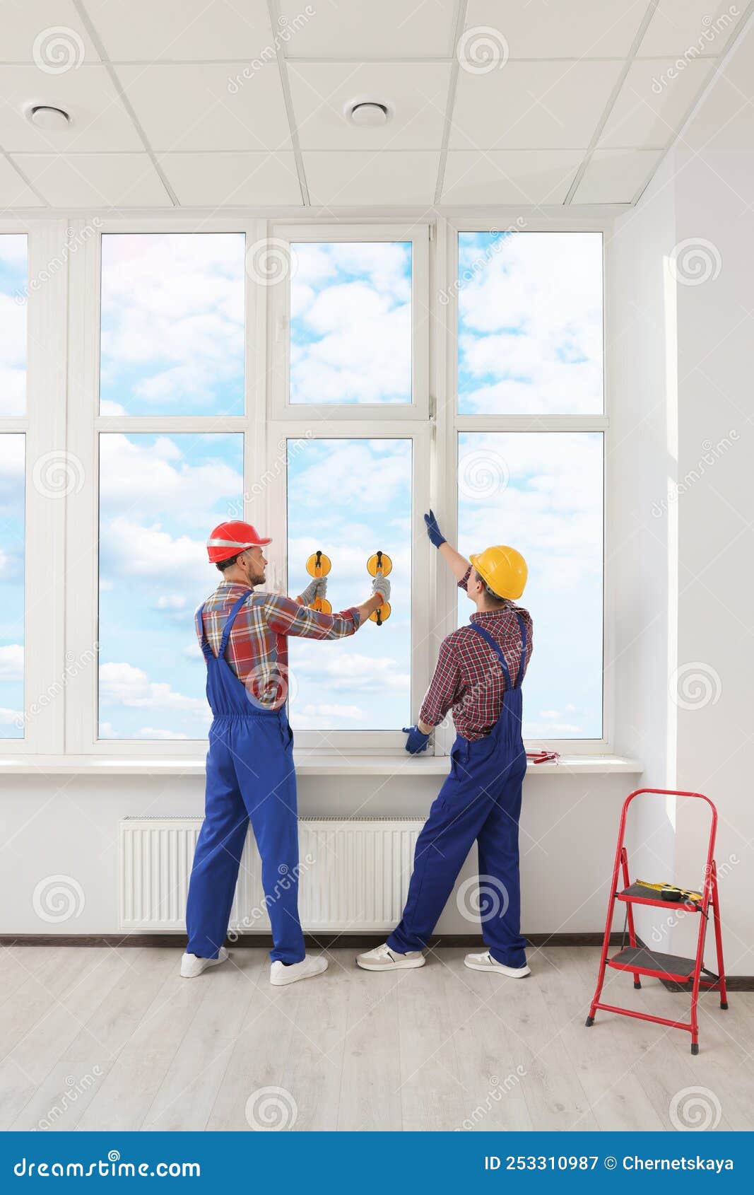 Workers Using Suction Lifters during Plastic Window Installation ...