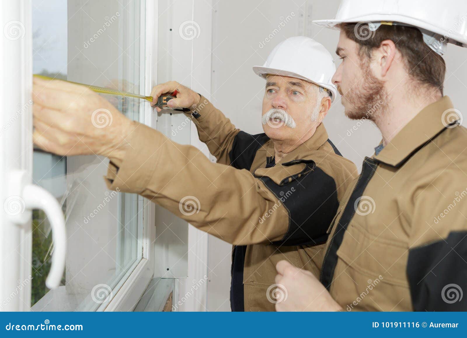 Workers Using Tape Measure Window in Construction Site Stock Photo ...