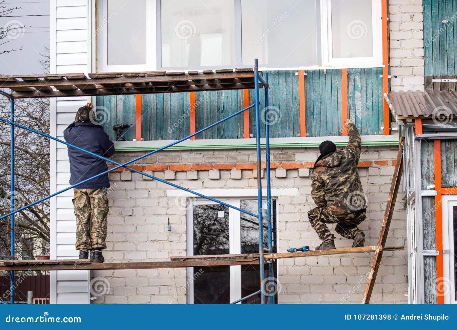 Workers Walling the House with Wall Siding Stock Photo - Image of color ...