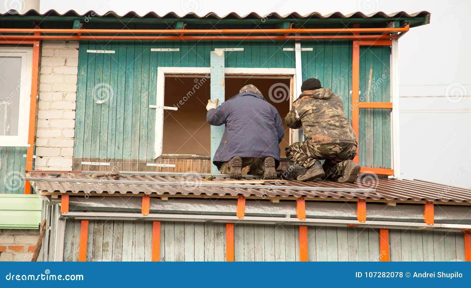 Workers Walling the House with Wall Siding Stock Photo - Image of ...