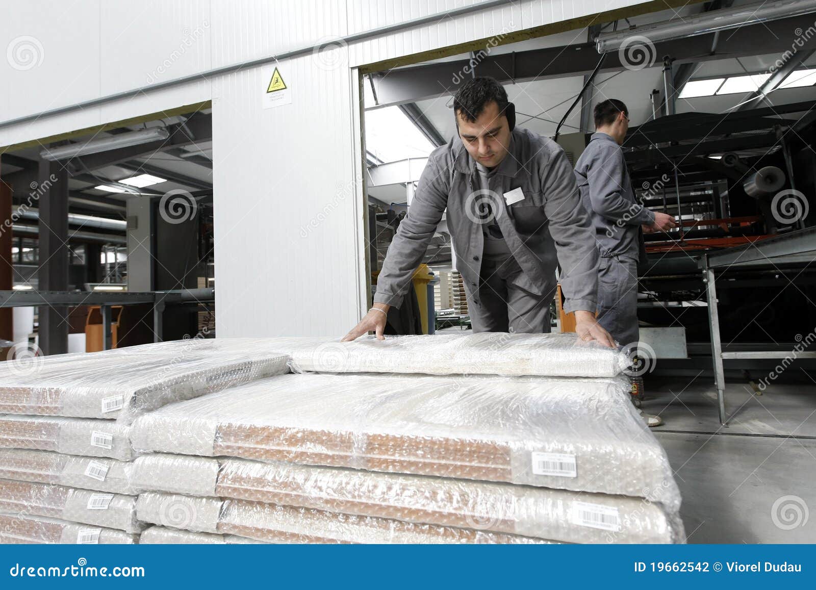 Workers in warehouse depot editorial photography. Image of merchandise ...