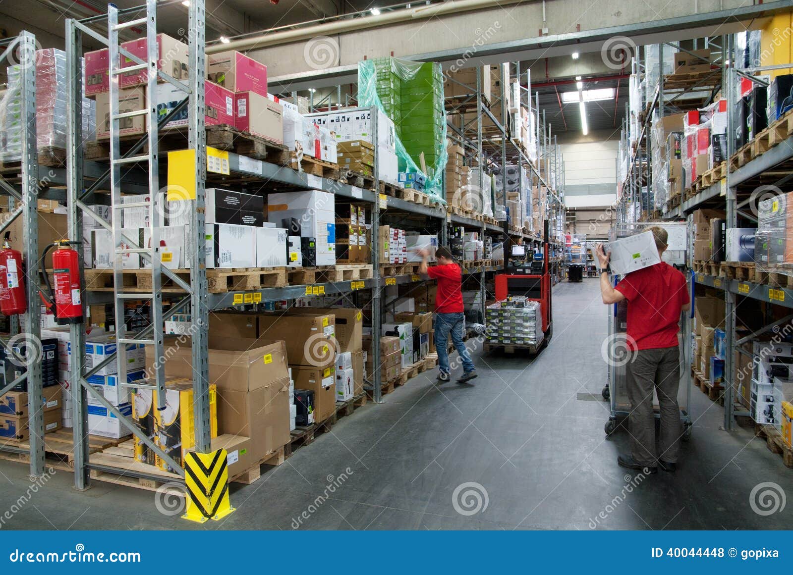 Workers in a warehouse editorial stock photo. Image of people - 40044448