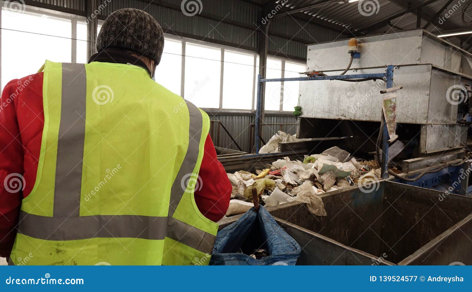 Workers At The Waste Processing Plant. Sorting Trash On A Conveyor Belt ...