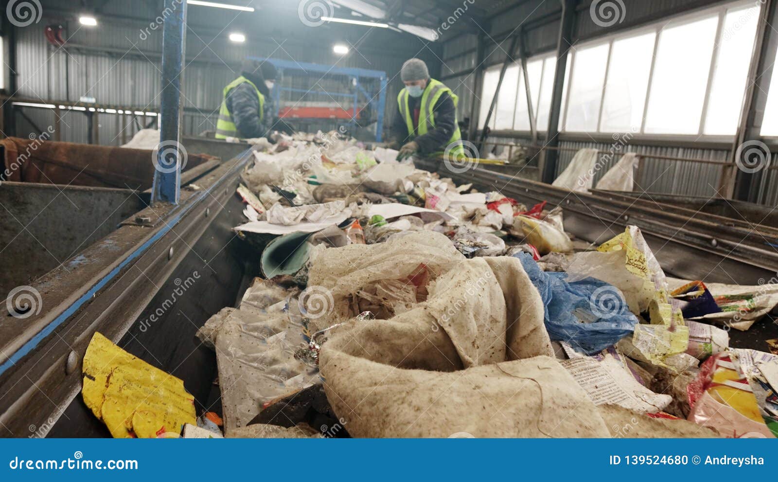 Workers at the Waste Processing Plant. Sorting Trash on a Conveyor Belt ...