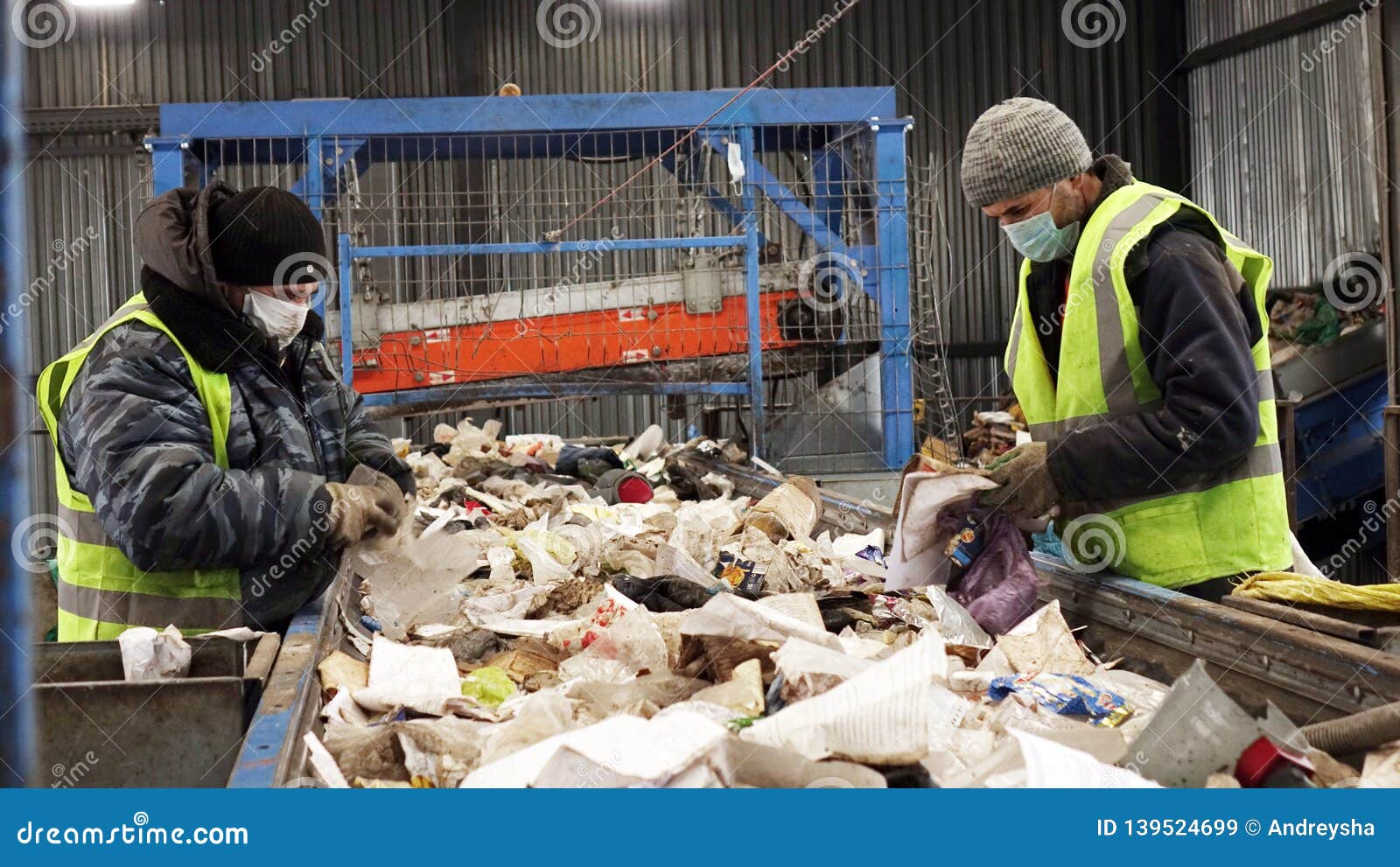 Workers at the Waste Processing Plant. Sorting Trash on a Conveyor Belt ...
