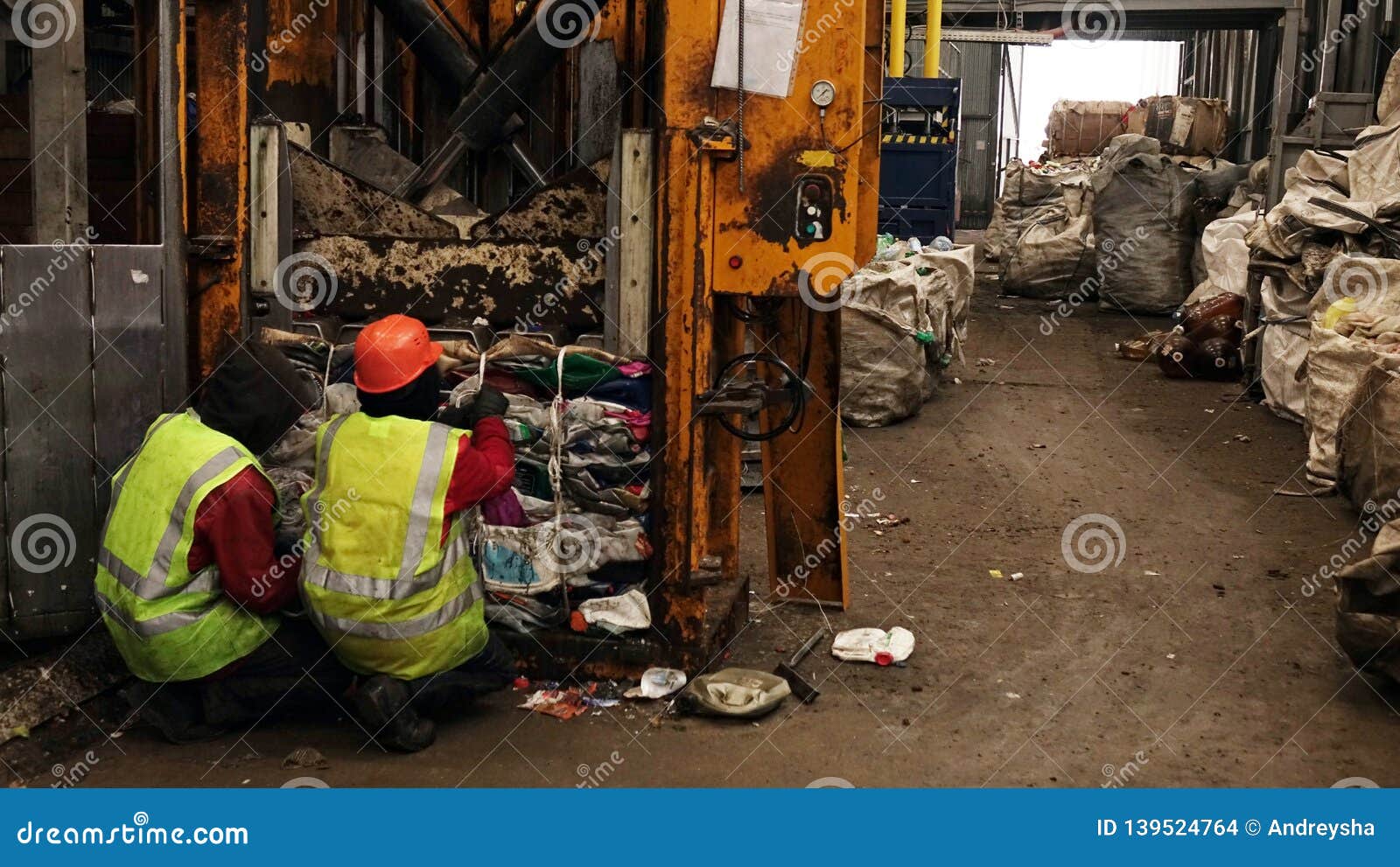 Workers At The Waste Processing Plant. Sorting Trash On A Conveyor Belt ...