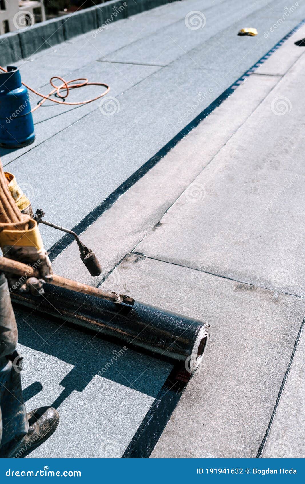 Workers Waterproofing Flat Concrete Roof Using Blowtorch and Bituminous ...