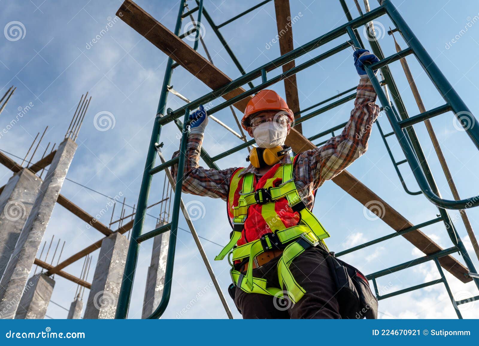 The Workers Wearing Safety Uniforms Working at Height at Construction ...
