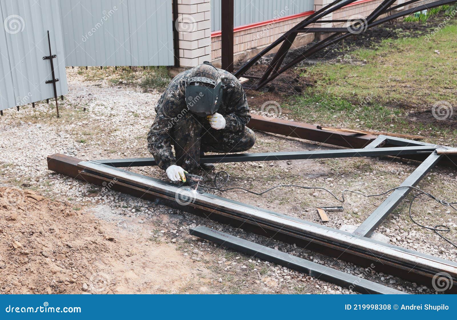Workers Weld Metal for Sliding Gates. Stock Photo - Image of rack ...