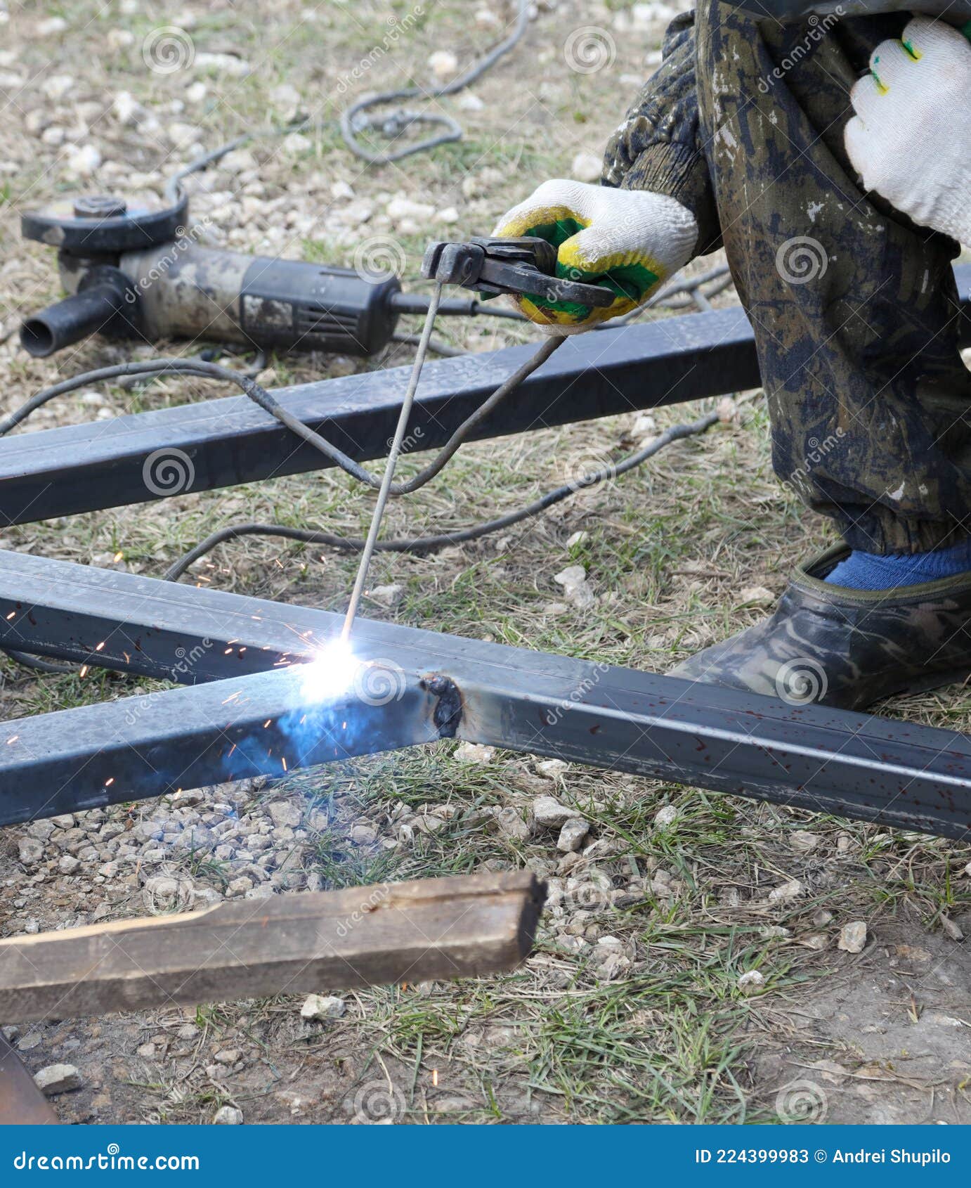 Workers Weld Metal For Sliding Gates. Royalty-Free Stock Photography ...