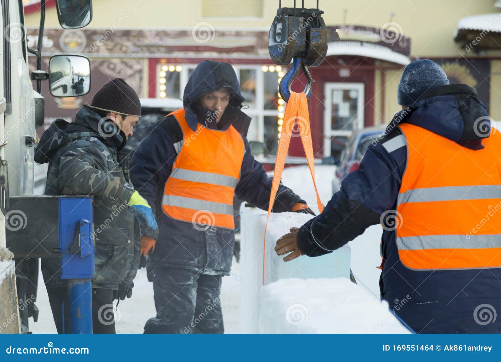 Workers in Winter Workwear Installing Ice Panels Stock Photo - Image of ...