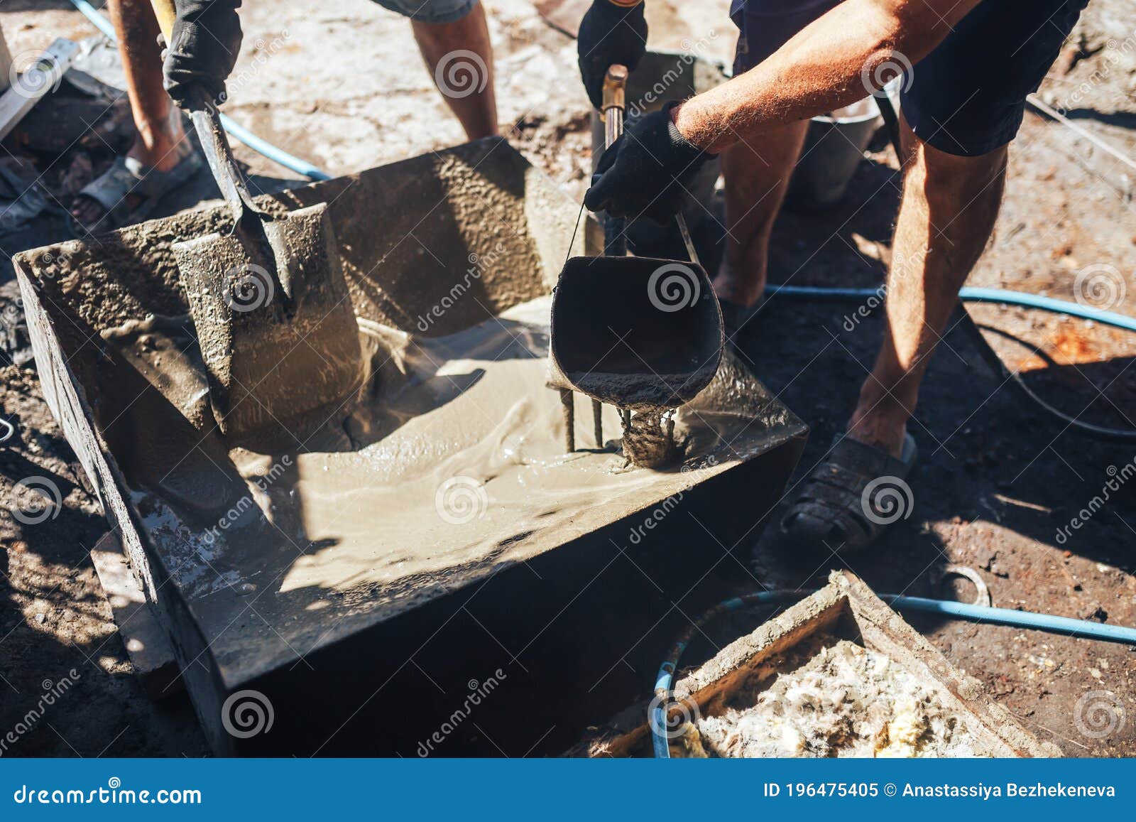 Workers Work with Cement Mortar, Loading the Hopper Bucket with Mortar ...