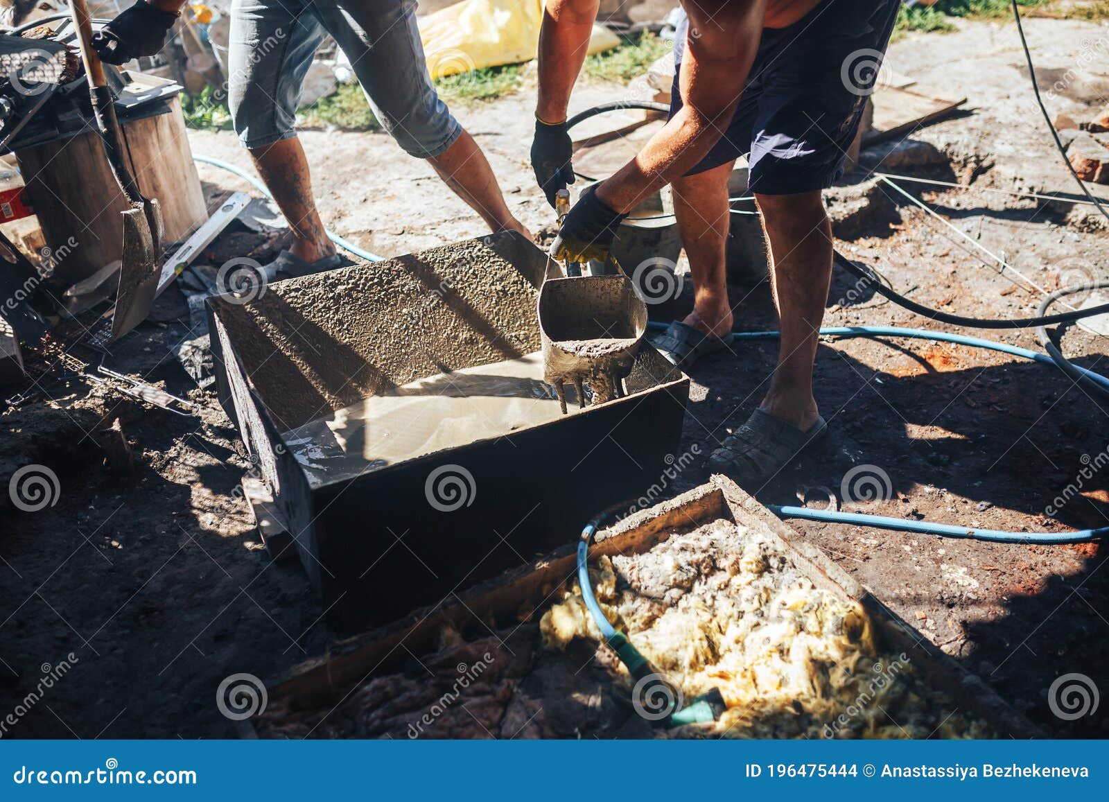 Workers Work with Cement Mortar, Loading the Hopper Bucket with Mortar ...