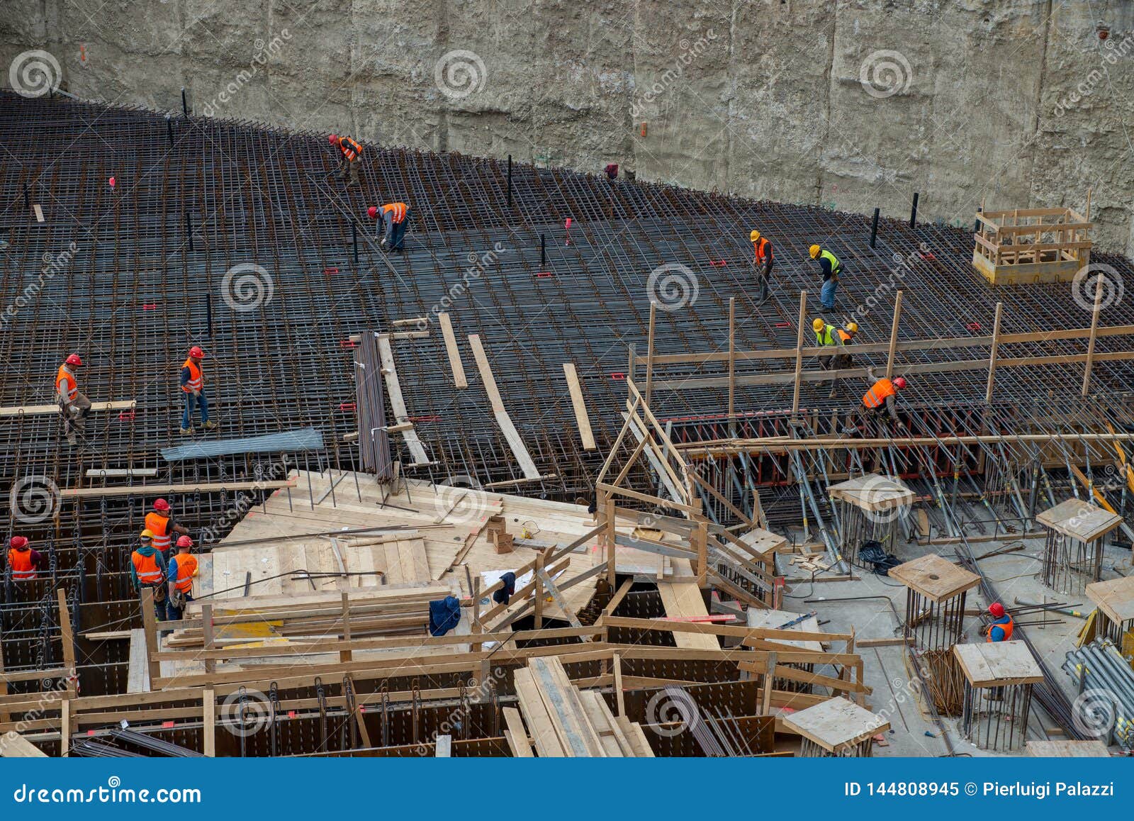Workers at Work for the Construction of the Reinforced Concrete Base ...