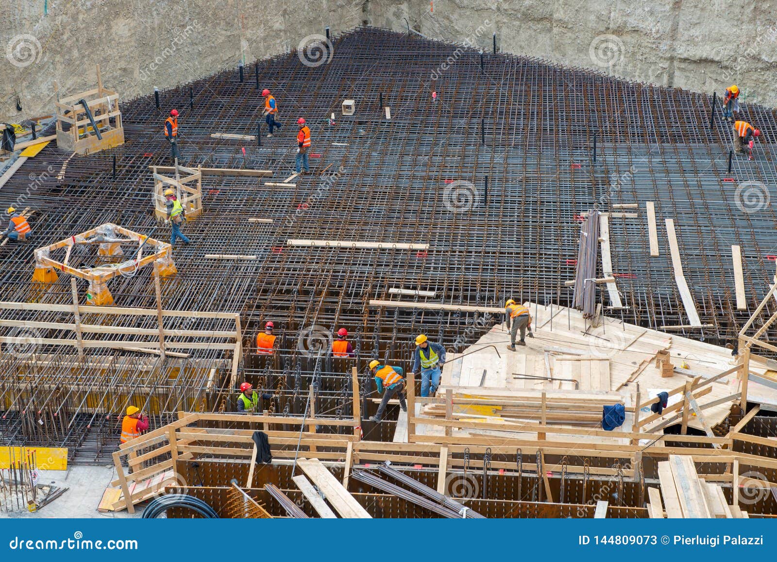 Workers at Work for the Construction of the Reinforced Concrete Base ...