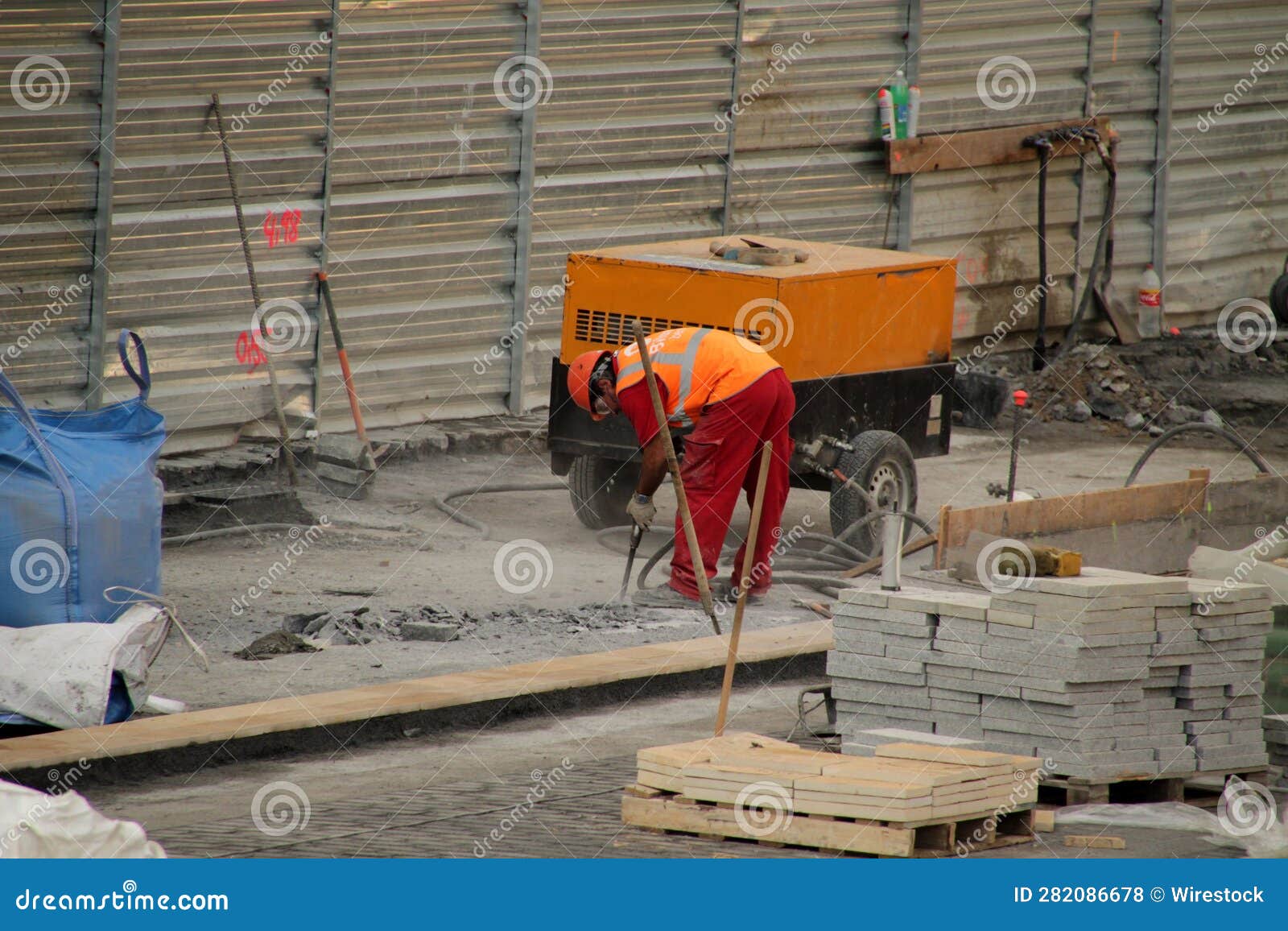 Workers Work at a Construction Site that is Under Construction, with ...
