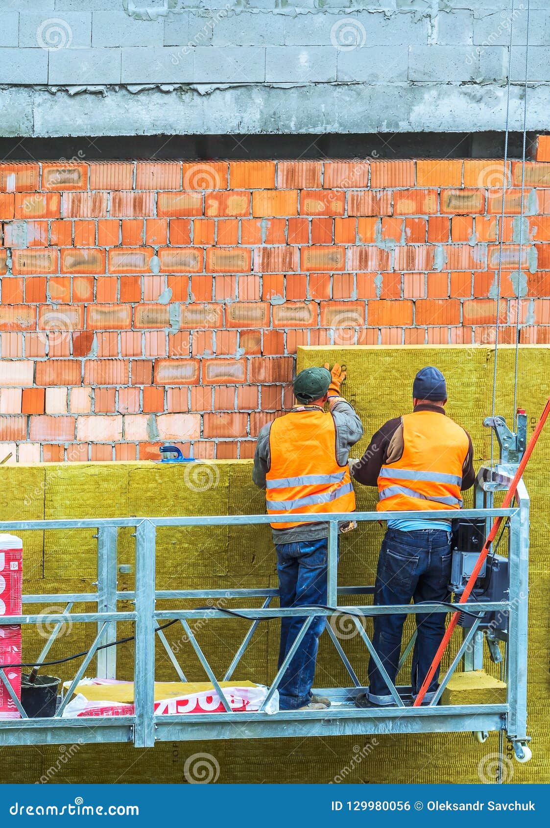 Workers Work on a Construction Site. Work is Underway on the Laying of ...
