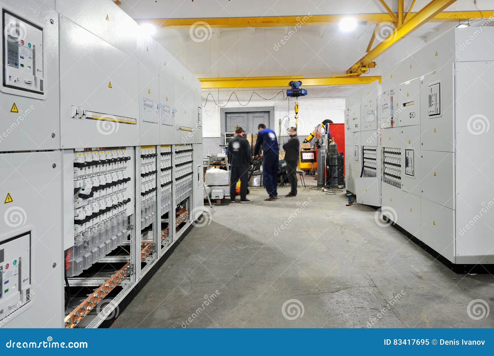 Workers Work at the Factory for the Production of Electrical Equipment ...