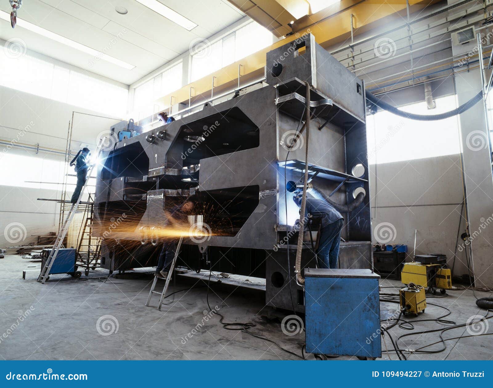 Workers in Action on Medium-heavy Duty Structure Work in Iron an ...