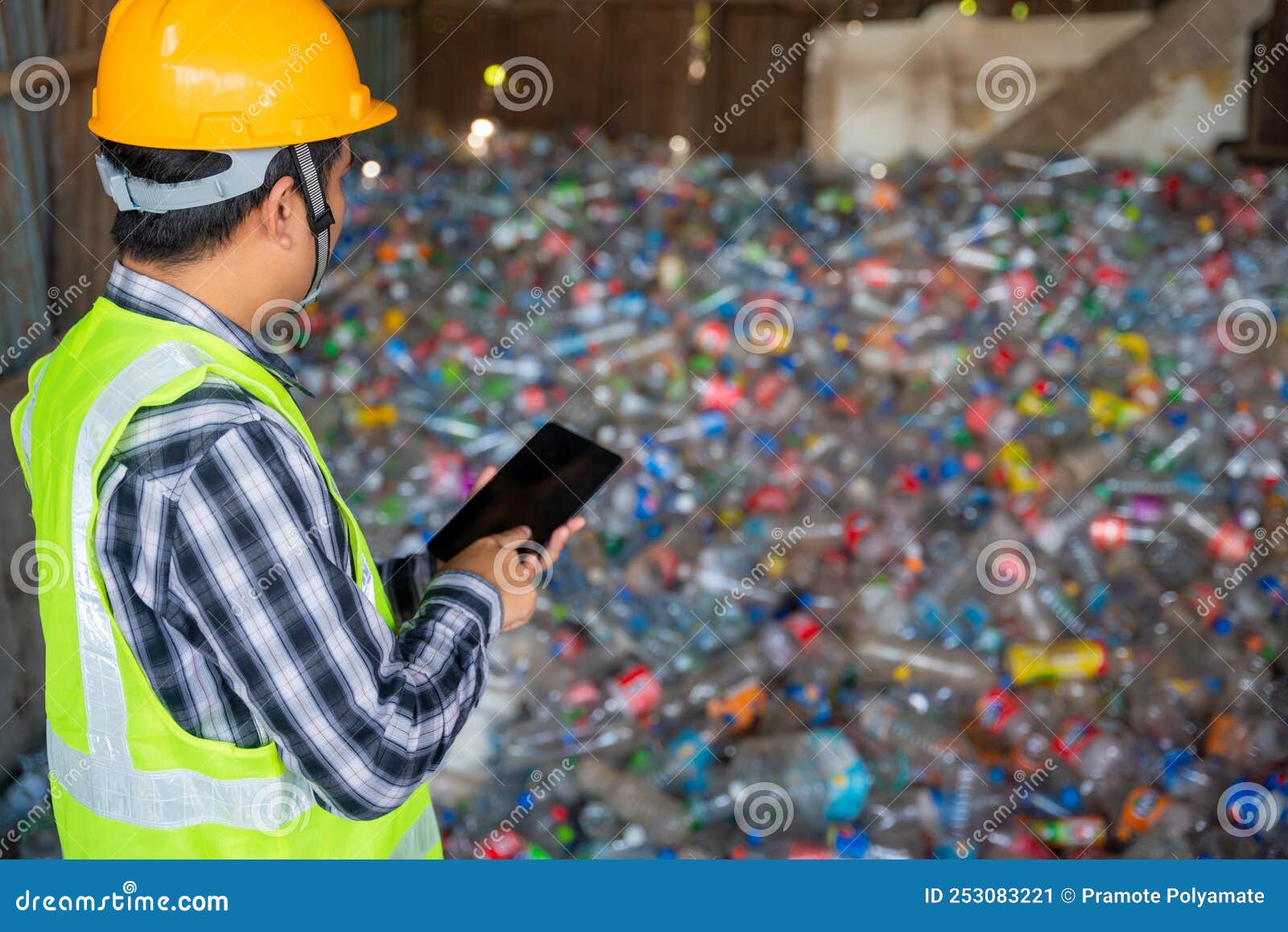 A Workers Work on Recycle Waste, Recycling Analyst Looking at Recycling ...