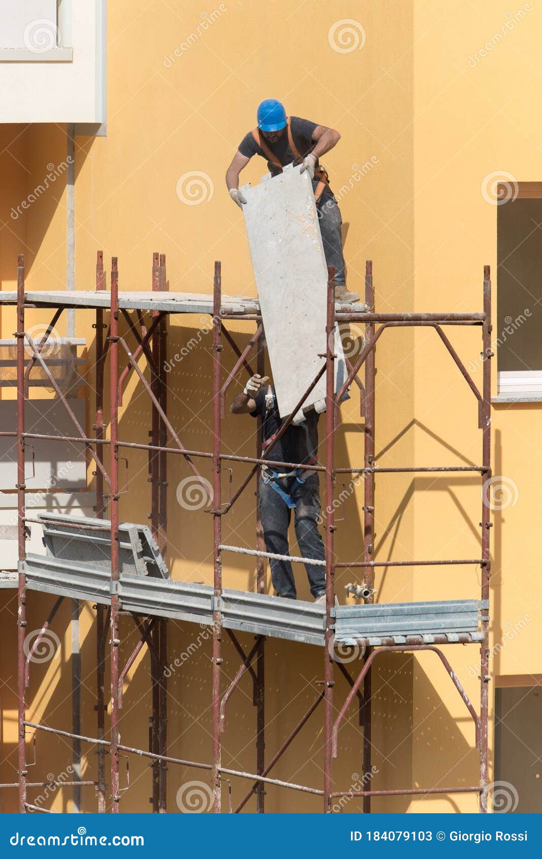 Parma, Italy - May 2019: Workers at Work on a Scaffold in a Building ...