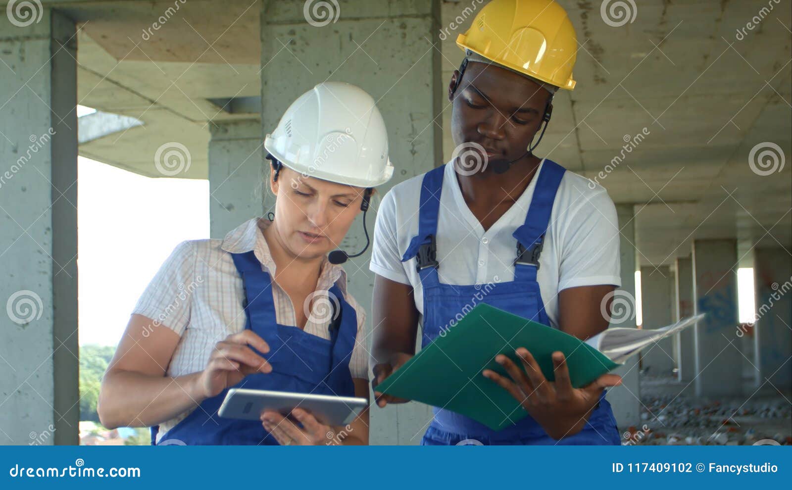 Workers Working on Building Site with Tablet Stock Photo - Image of ...