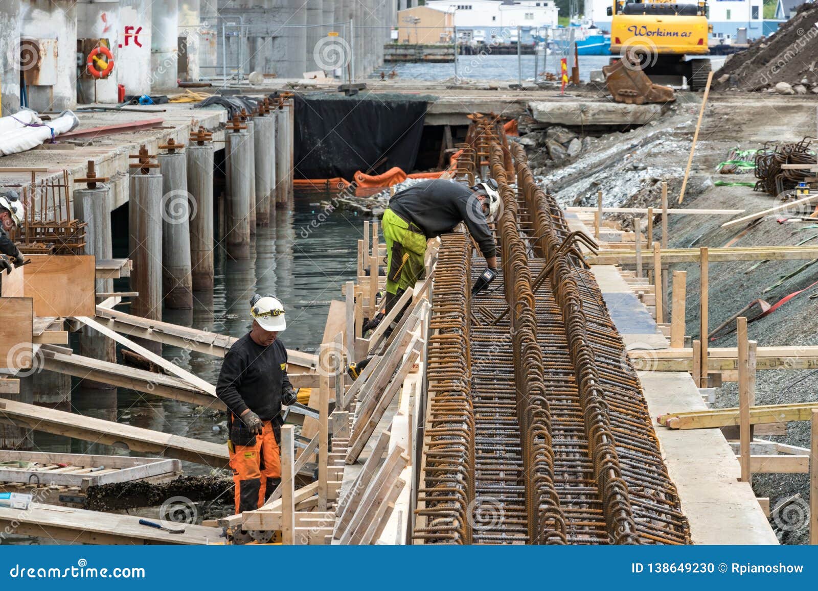 Workers Working on a Concrete Construction Under the Bridge of Tromso ...