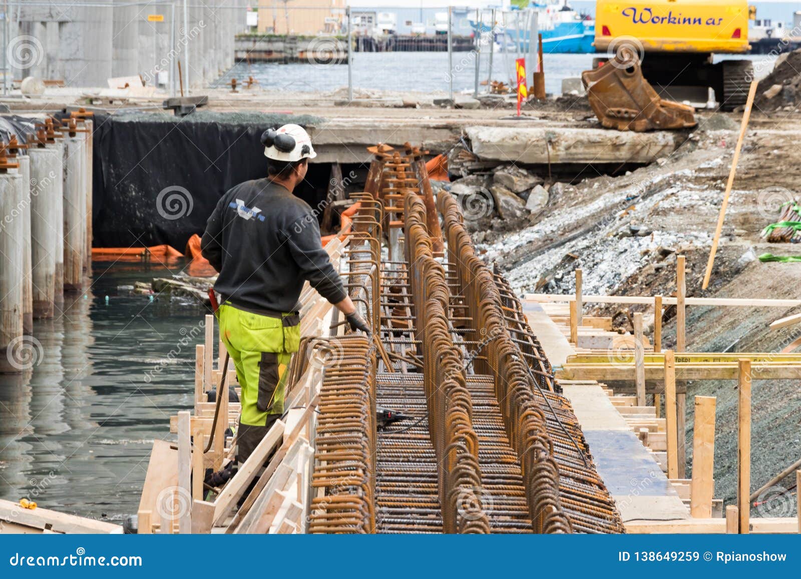 Workers Working on a Concrete Construction Under the Bridge of Tromso ...