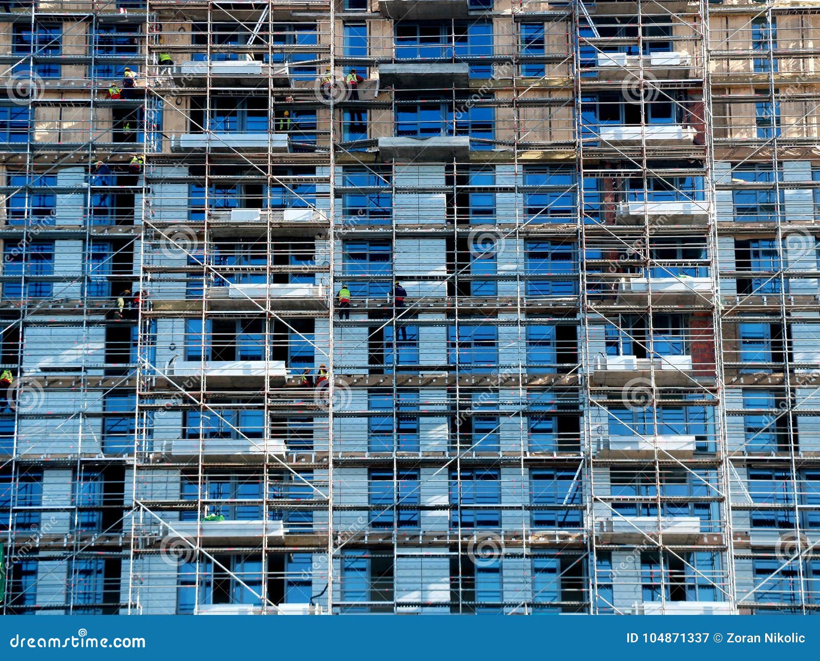 Workers on a high building stock image. Image of view - 104871337