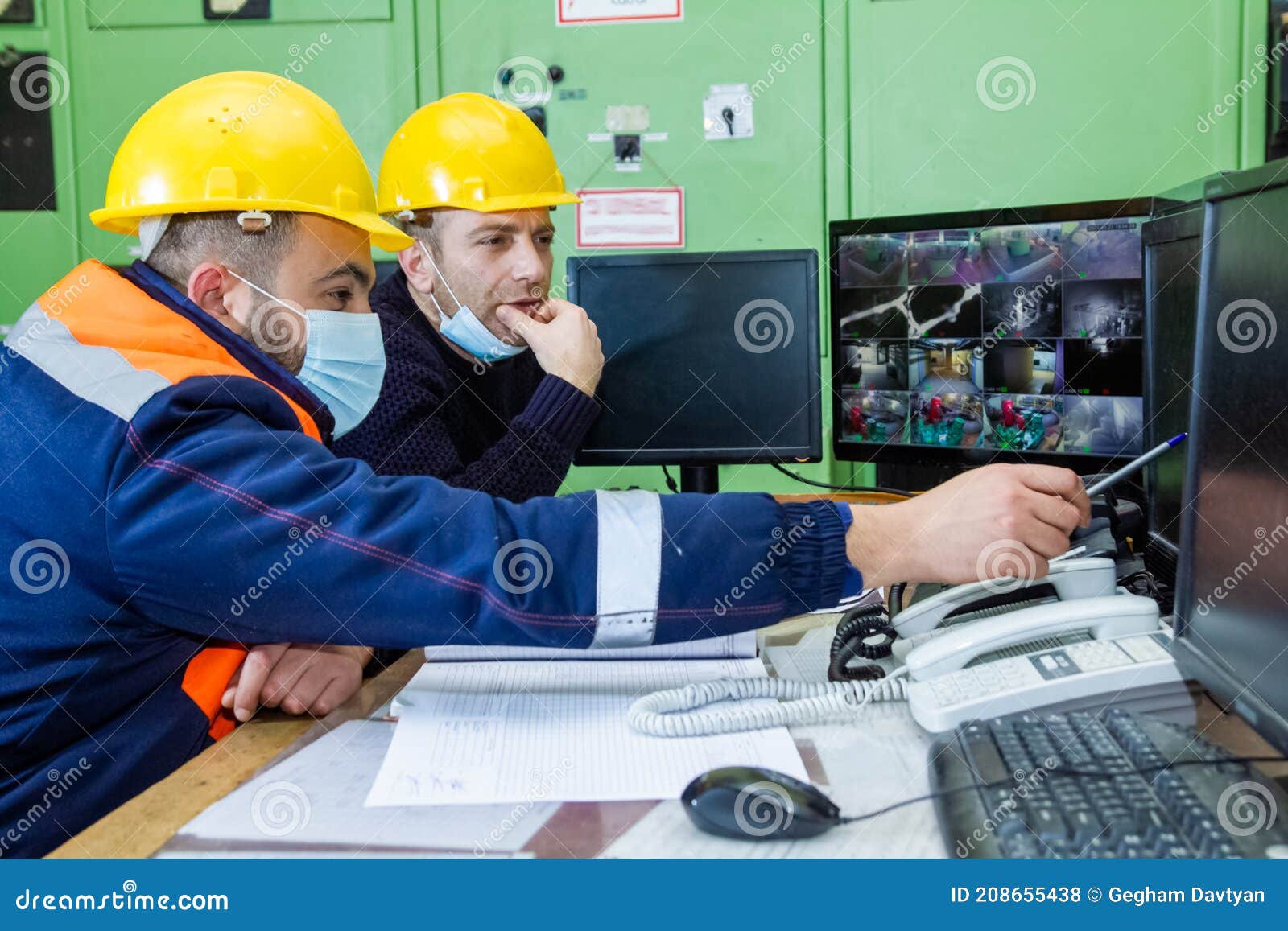 Workers with Yellow Helmet and Protective Mask at Work Stock Photo ...