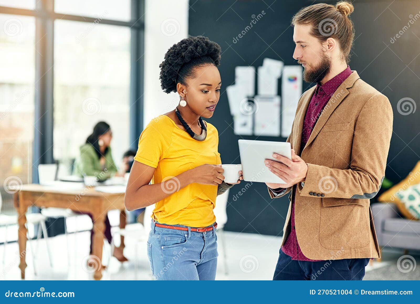 Working Alongside Technology is Essential in a Creative Business. Young ...