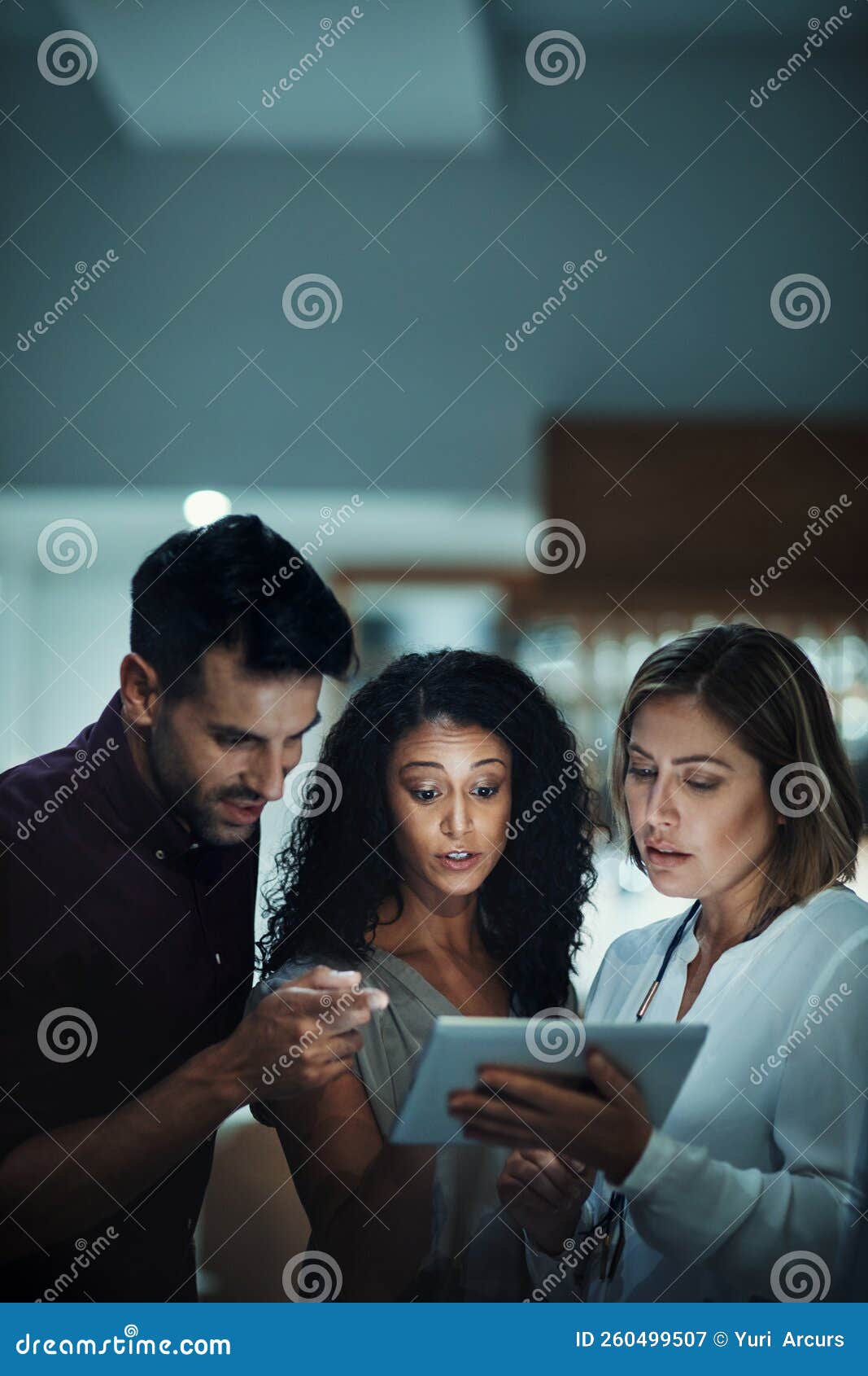 Working As One To Get it Done. a Group of Colleagues Using a Digital ...