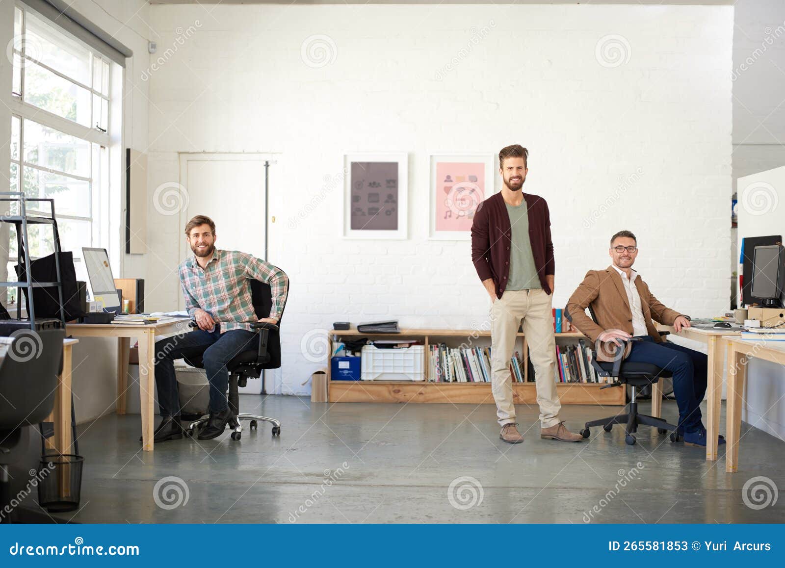 Working As a Team Gets Things Done. Open Office Space with 3 Male ...