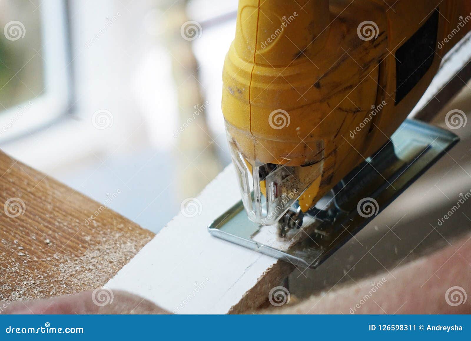 Working with an Automatic Electric Saw Works in a Carpentry Workshop ...