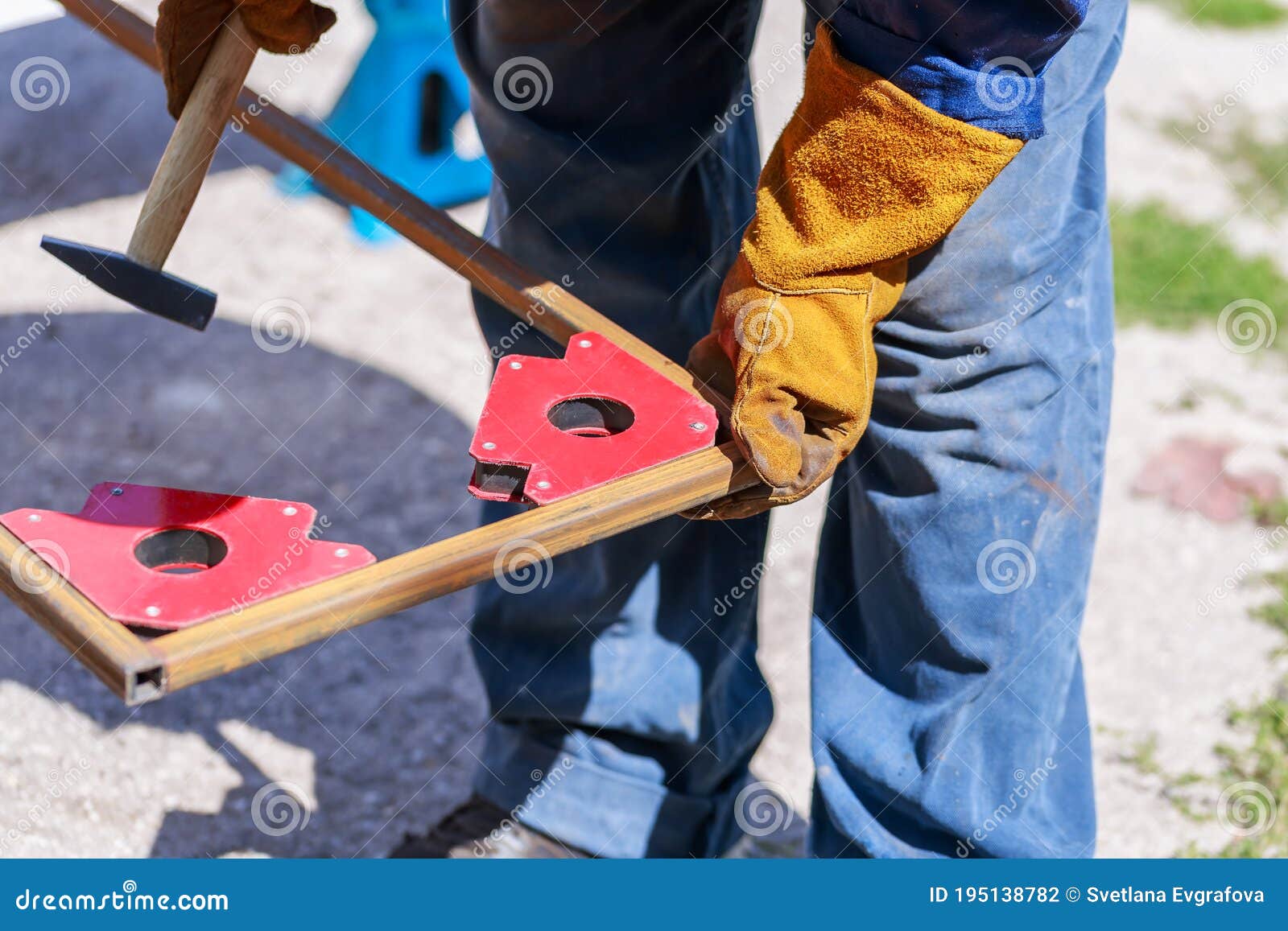 Working Auxiliary Tools in the Hands of a Worker Welder. Using a ...