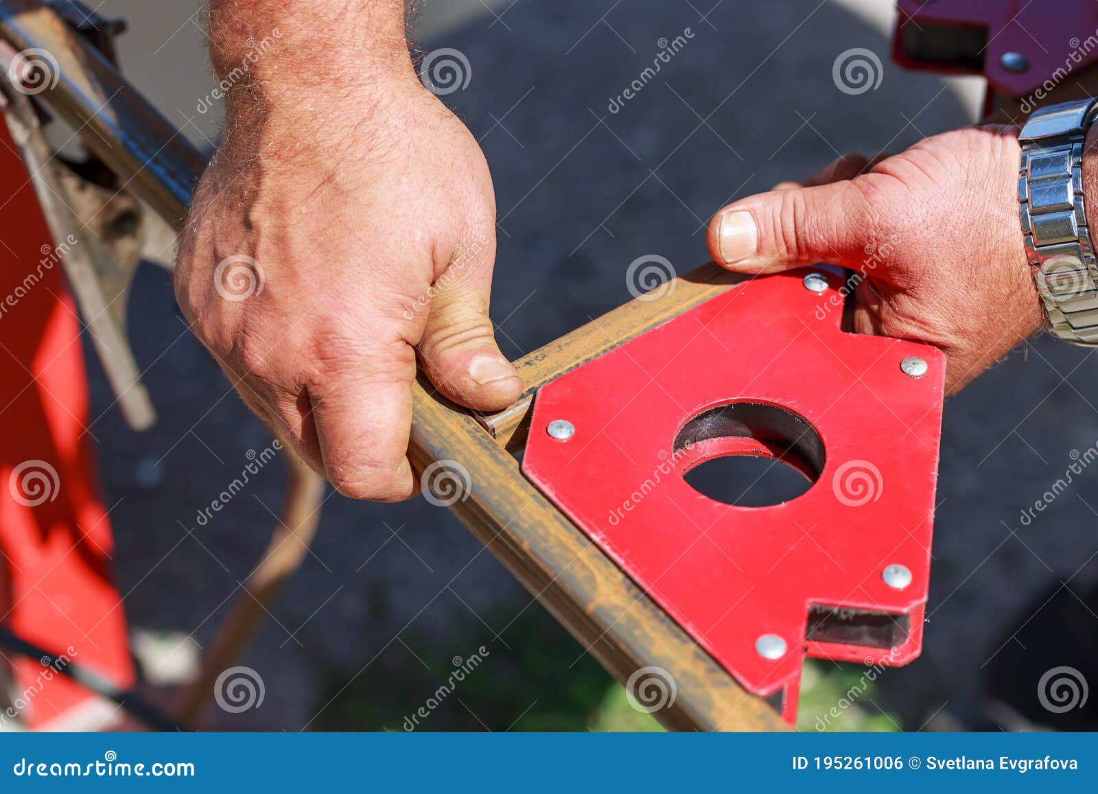 Working Auxiliary Tools in the Hands of a Worker Welder. Using a ...