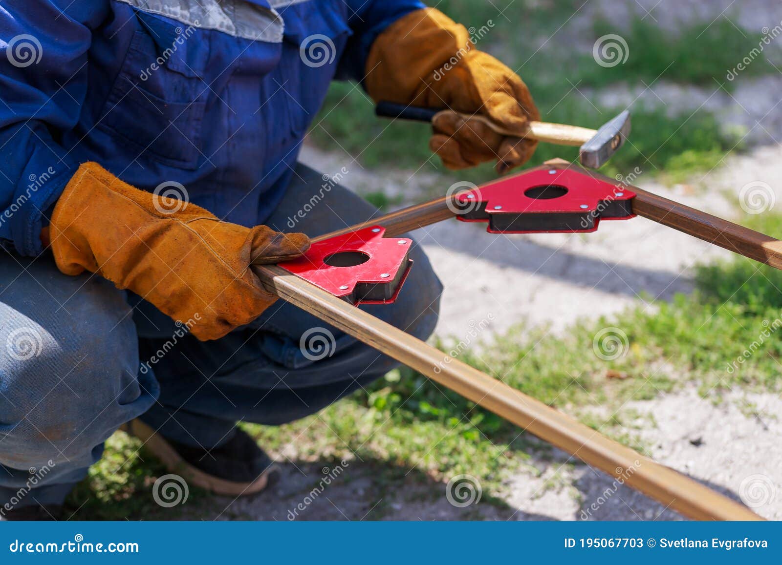 Working Auxiliary Tools in the Hands of a Worker Welder. Using a ...