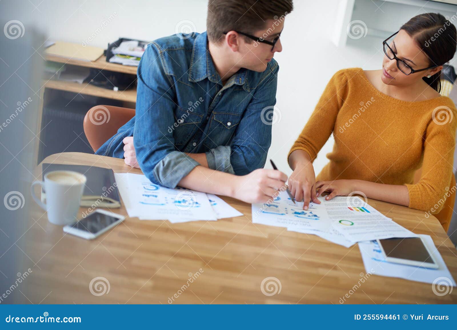 Working Away at Their Latest Project. Two Colleagues Working Together ...