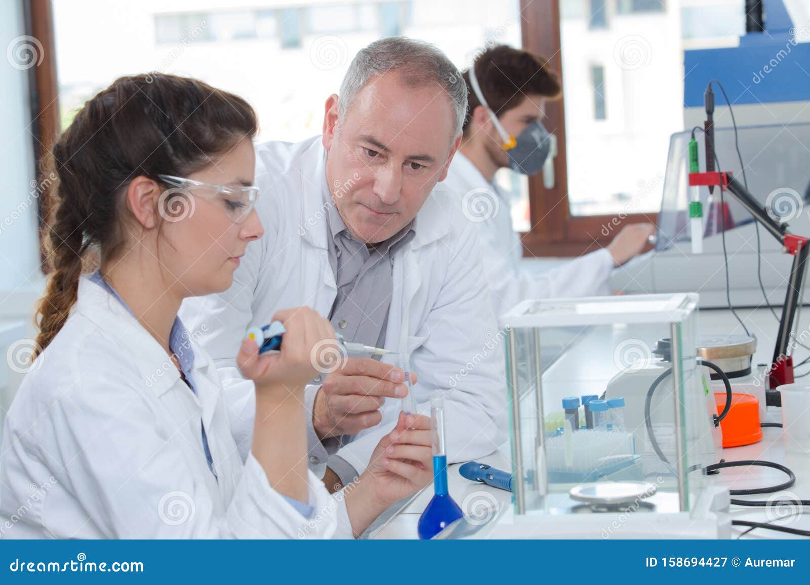 Working in biology lab stock image. Image of microscopic - 158694427