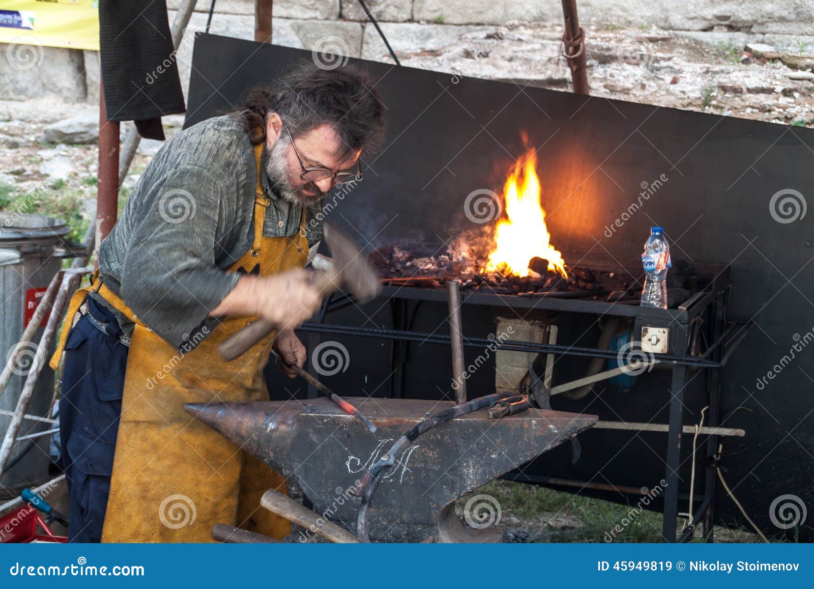 Working blacksmith editorial stock image. Image of metalwork - 45949819