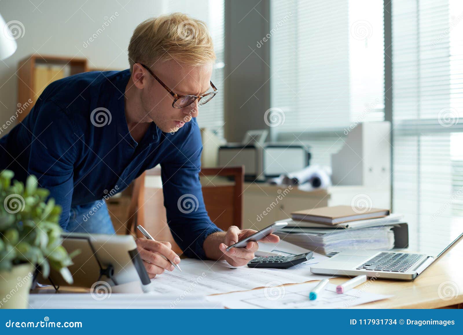 Working on blueprint stock photo. Image of architect - 117931734 Working on blueprint stock photo. Image of architect - 117931734