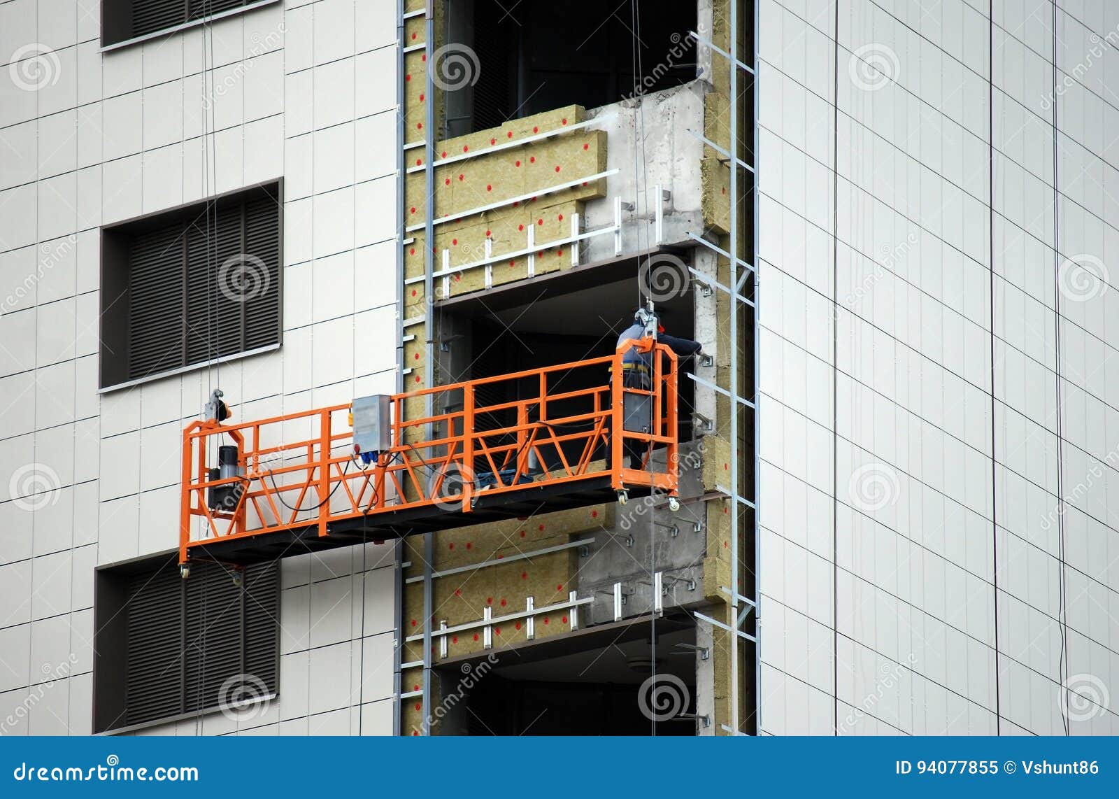 The Working Builder are on the Elevator and Works at Height when ...