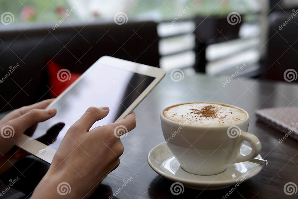 Working in a Cafe with a Tablet and a Cup of Coffee Stock Photo - Image ...
