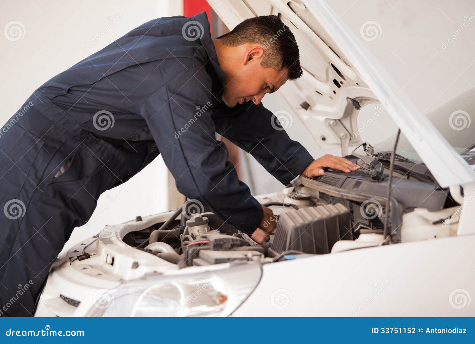 Working on a car engine stock photo. Image of transportation - 33751152