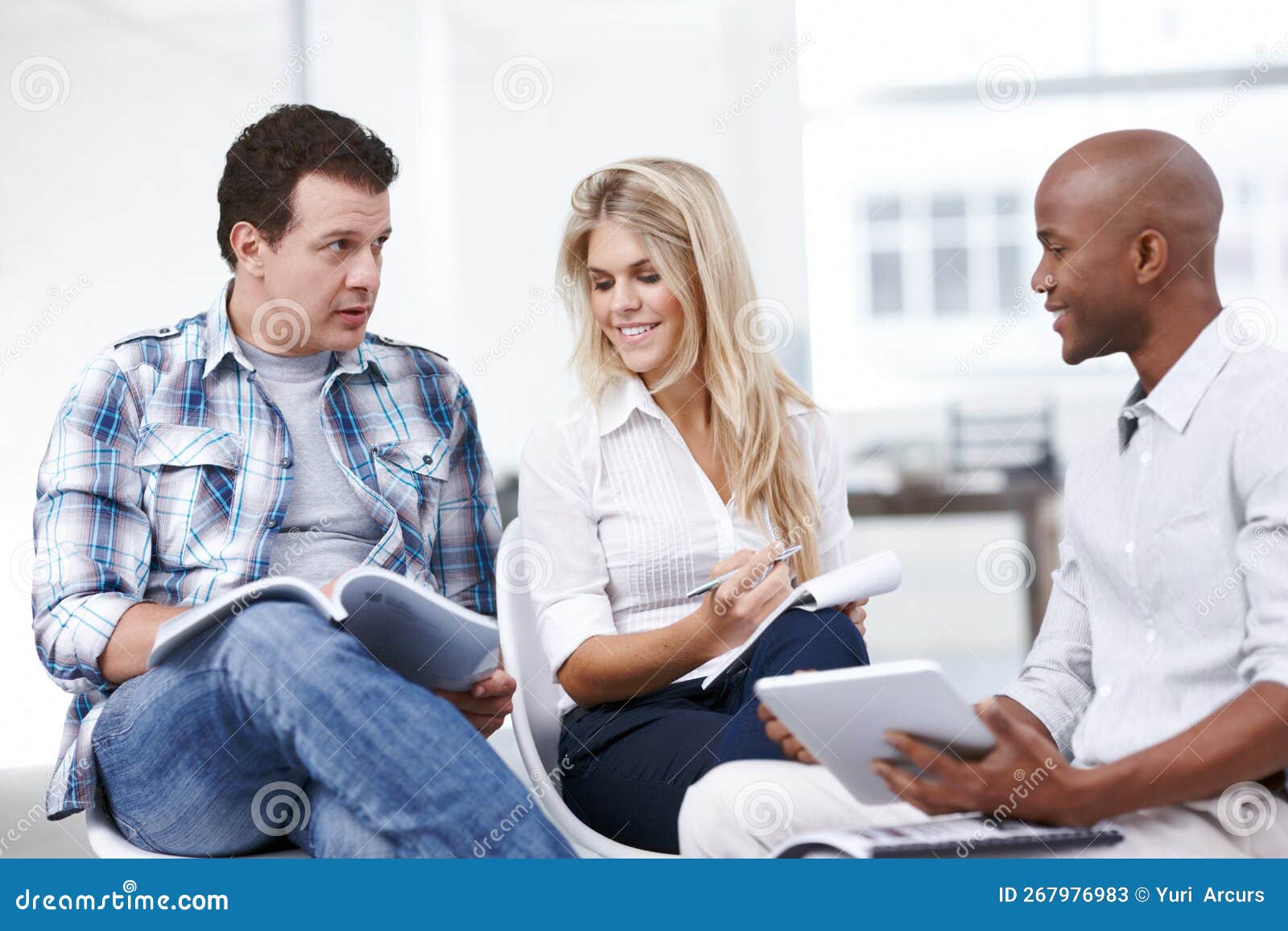 Working on a Client Presentation. a Group of Businesspeople in a ...